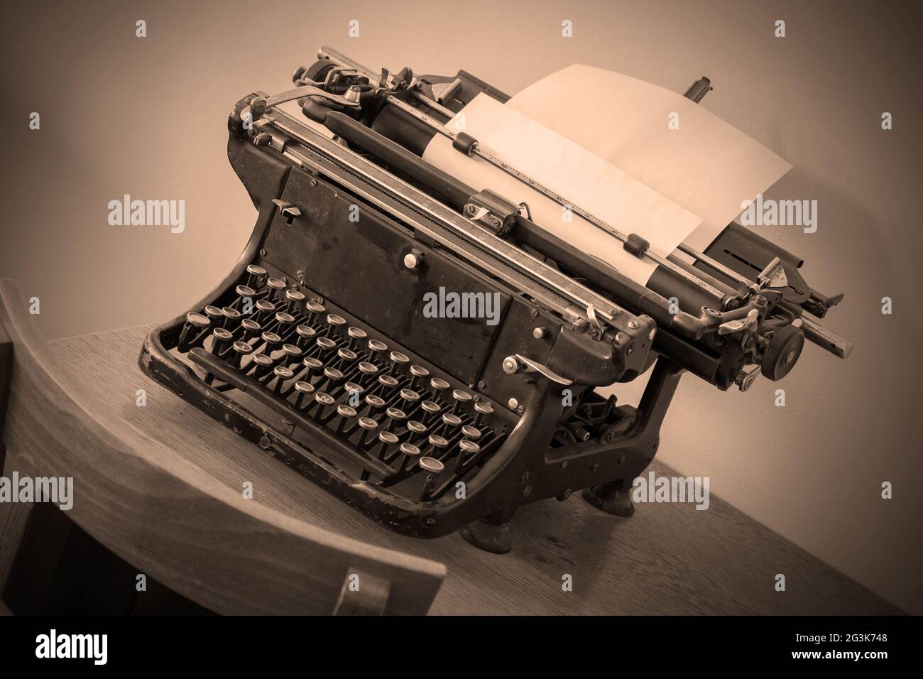 Old typewriter on a small table Stock Photo - Alamy