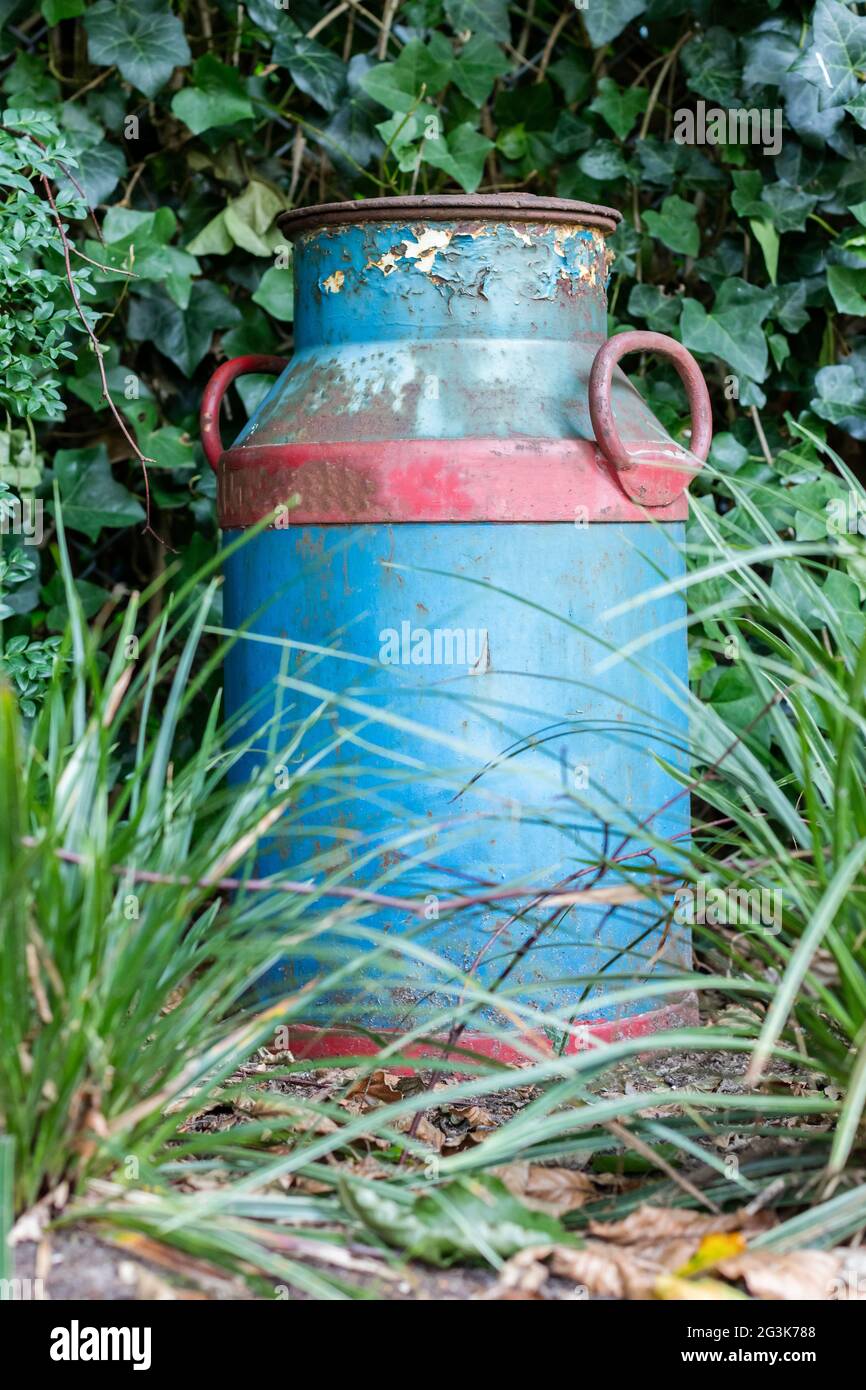 Old buckets milk, beautifully painted Stock Photo - Alamy
