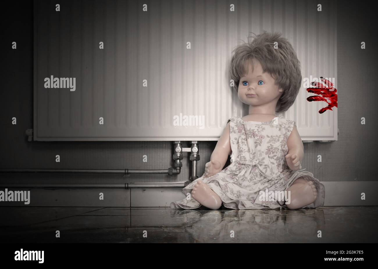 Concept of child abuse - Bloody doll Stock Photo - Alamy