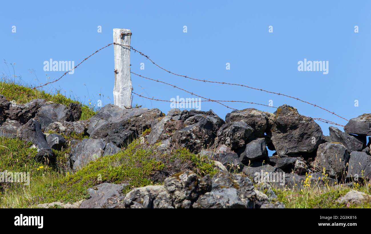 Barrier with barbed wire Stock Photo - Alamy