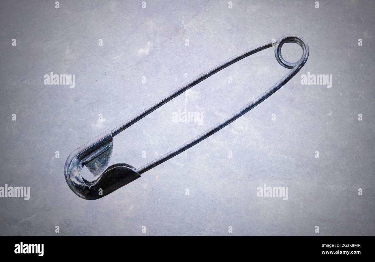Regular safety pin Stock Photo - Alamy