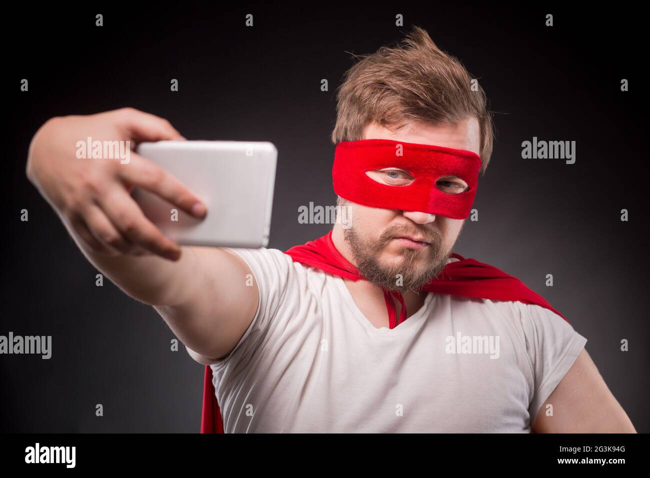 Super hero man making photos Stock Photo - Alamy