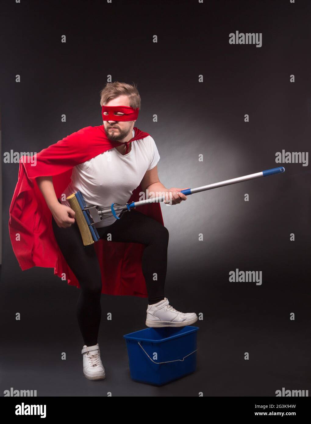 Super hero with cleaning equipment Stock Photo - Alamy