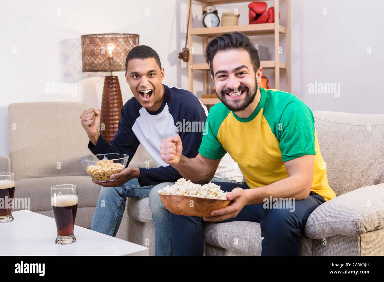 Young man drinking beer home hi-res stock photography and images - Alamy