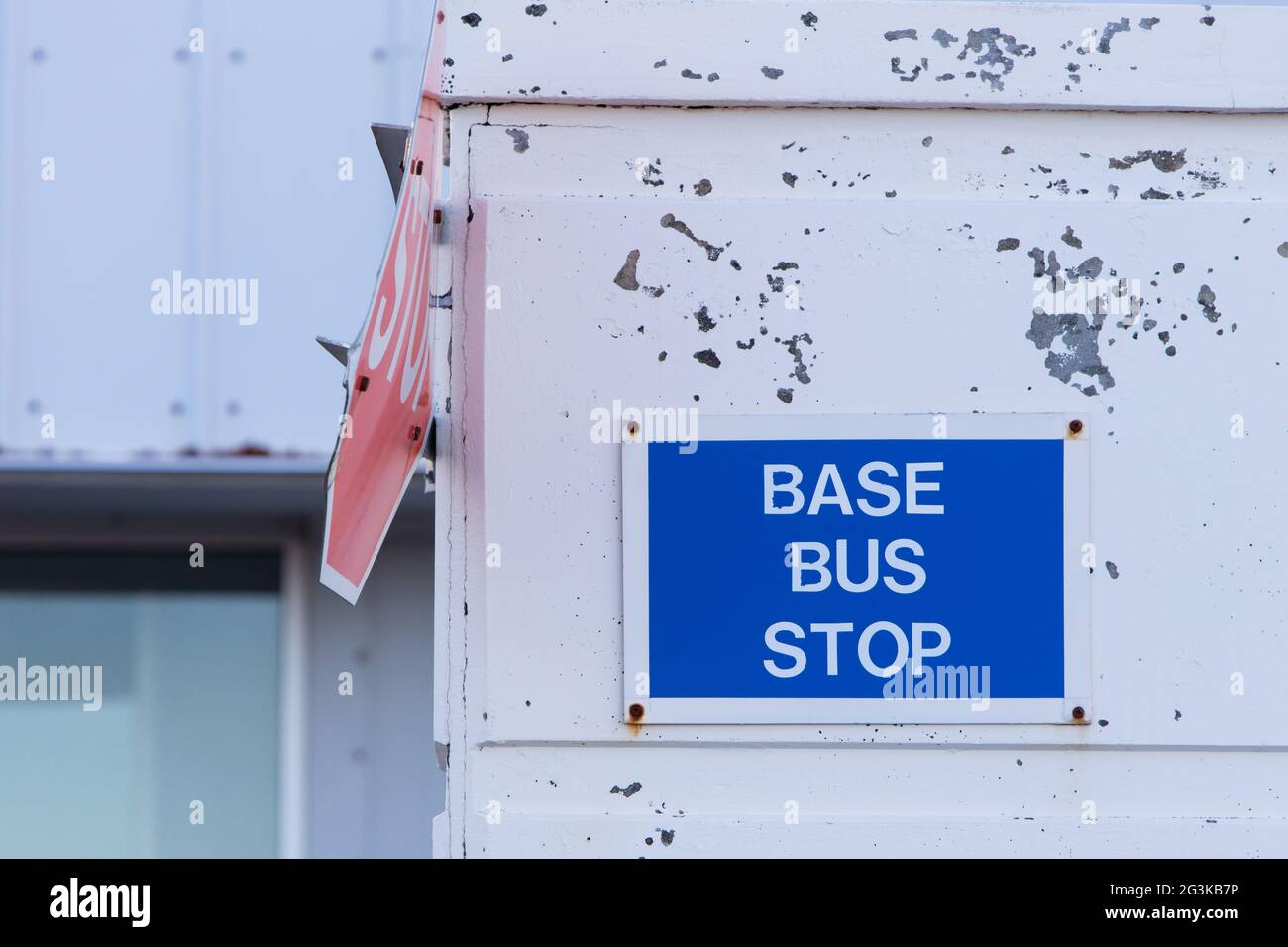 Bus stop sign on a wall Stock Photo - Alamy