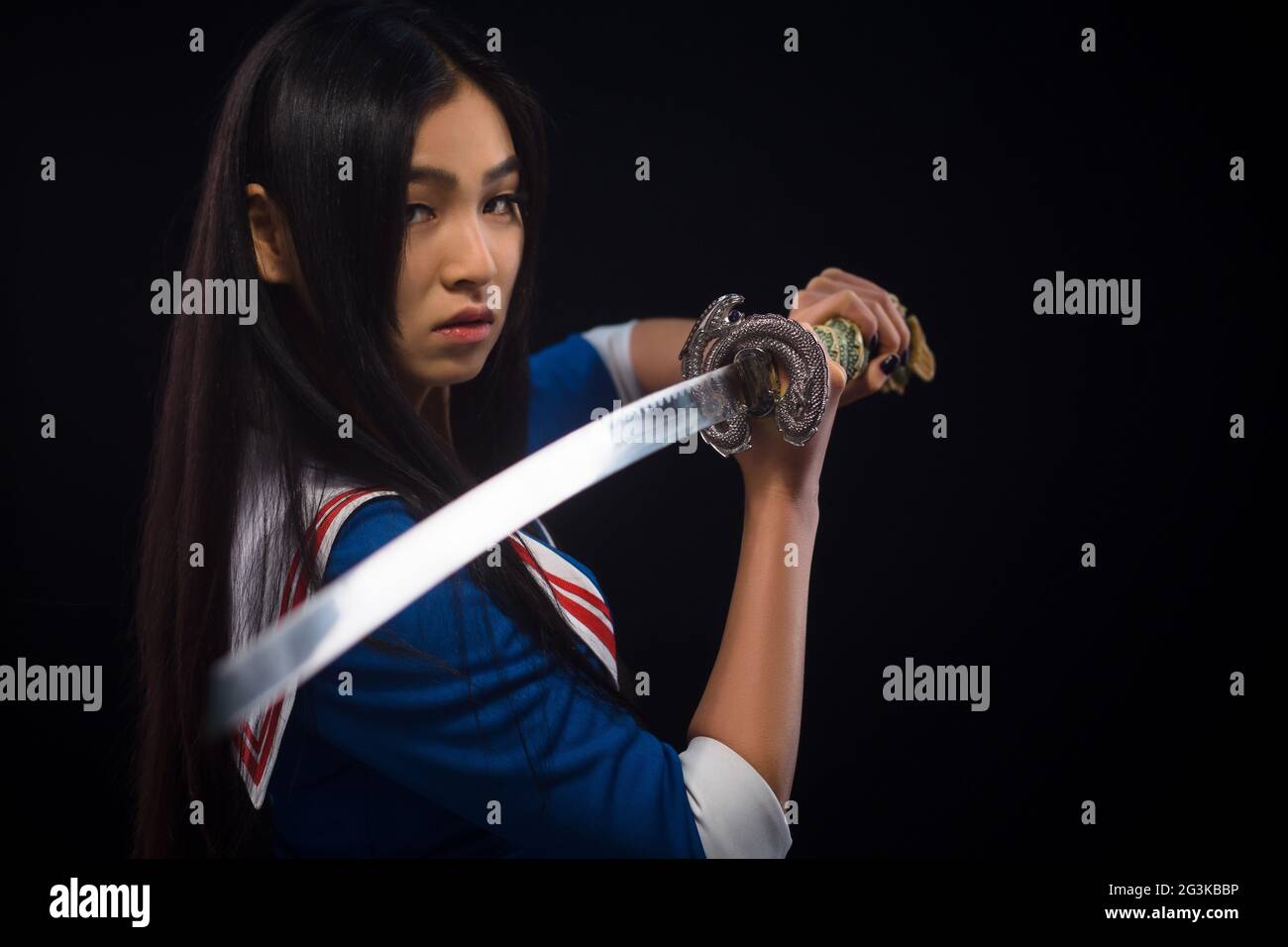 Asian lady with sword in studio Stock Photo - Alamy