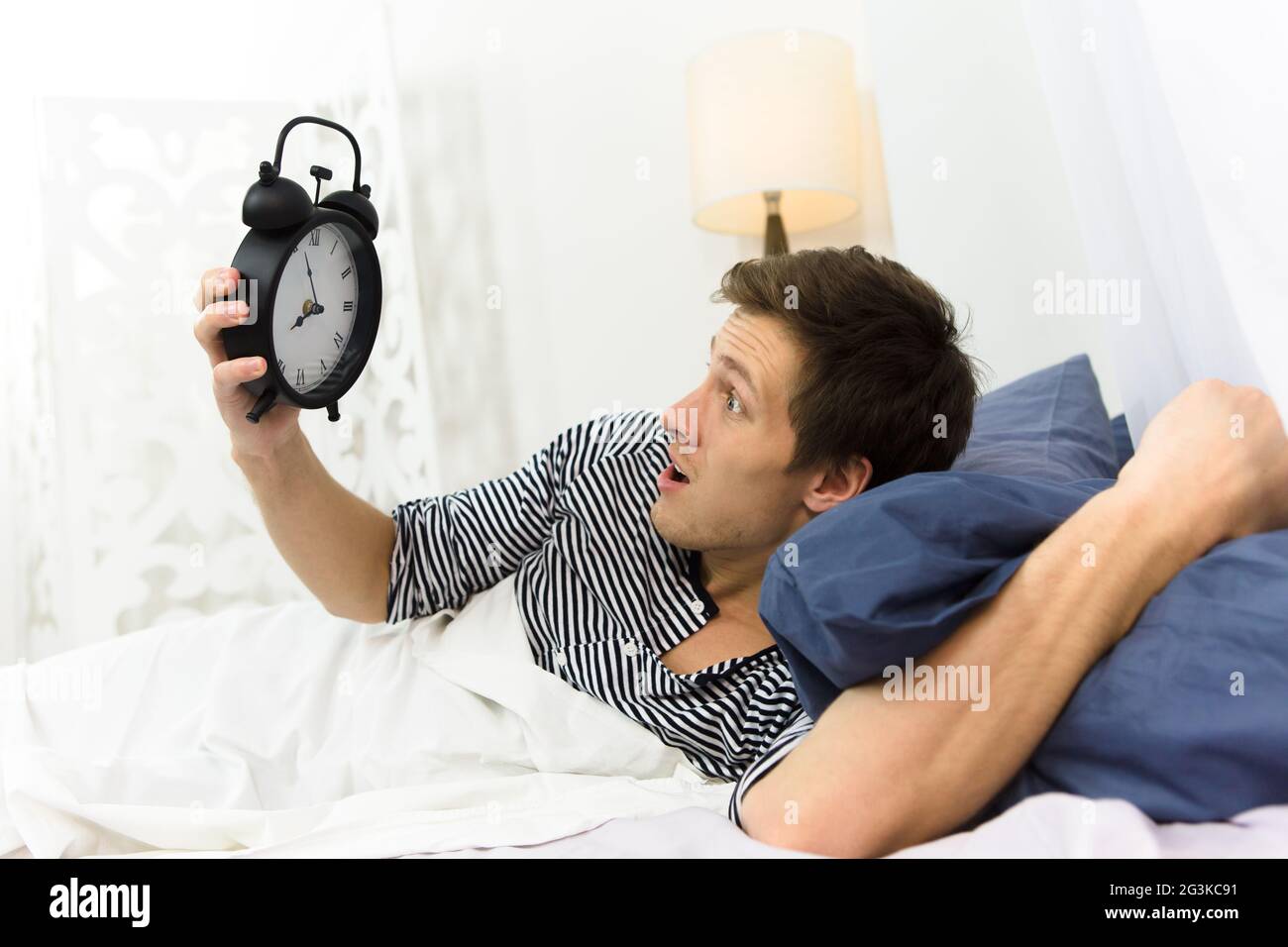 Man with clock hi-res stock photography and images - Alamy