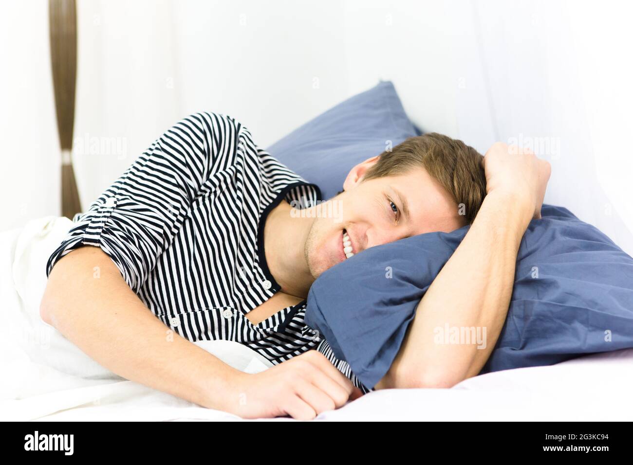 Sleeping man in bed white hi-res stock photography and images - Alamy