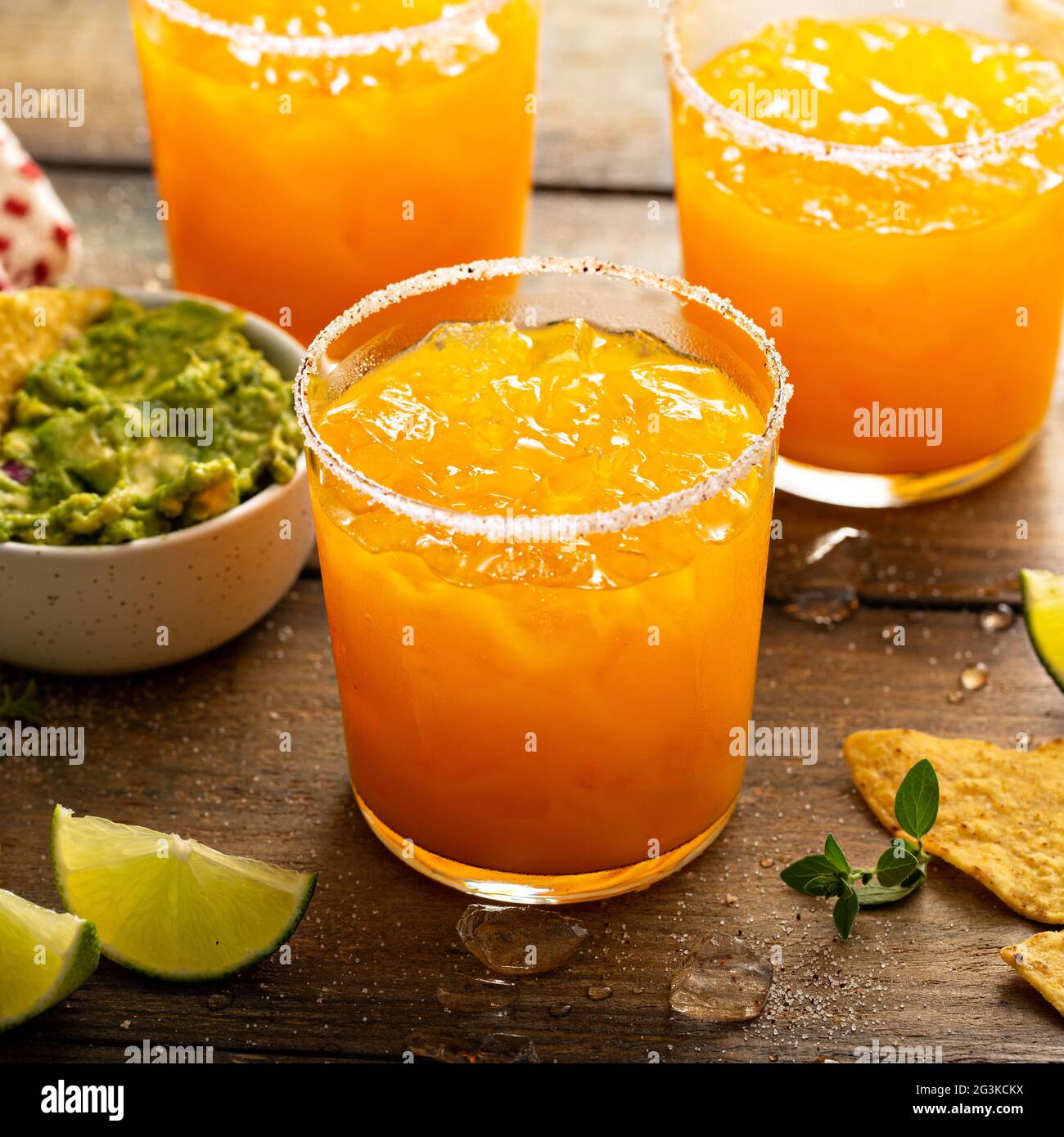Pineapple and mango margarita with chips and guacamole Stock Photo - Alamy