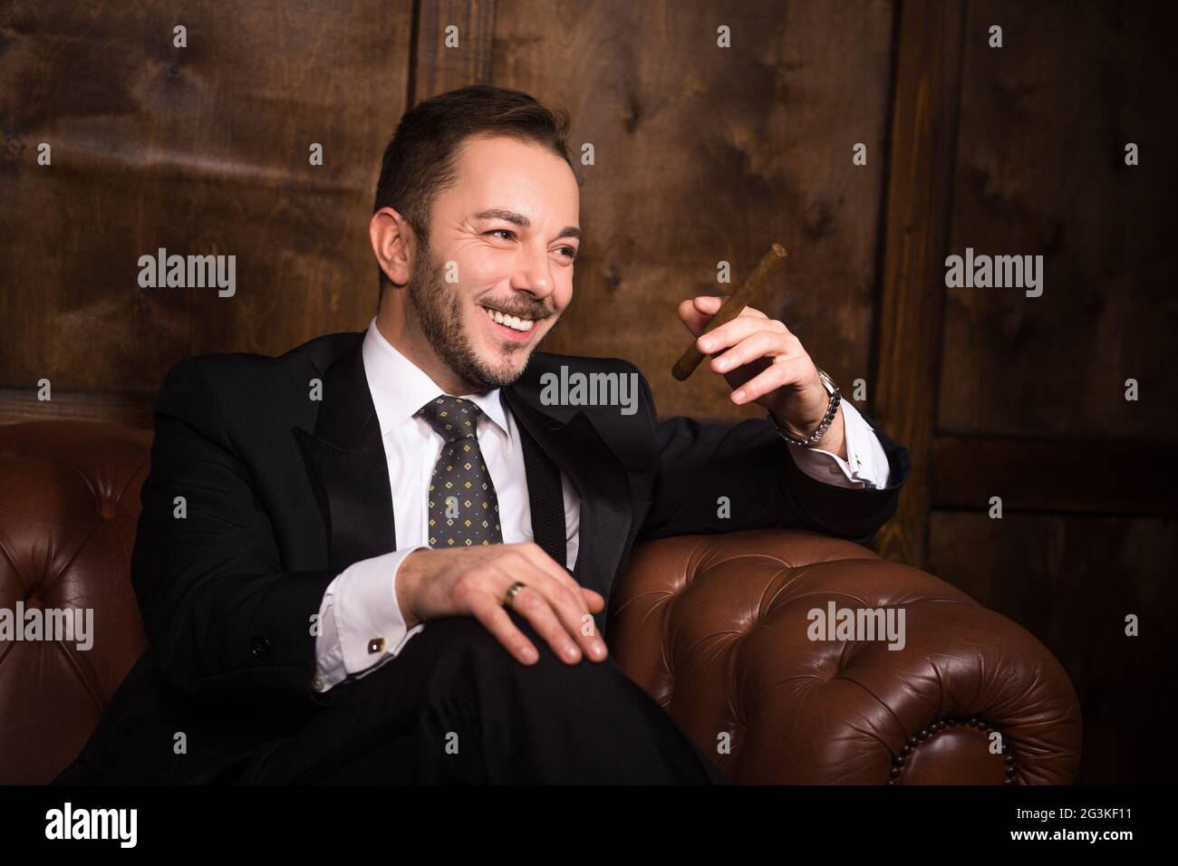 Rich businessman with cigar Stock Photo - Alamy