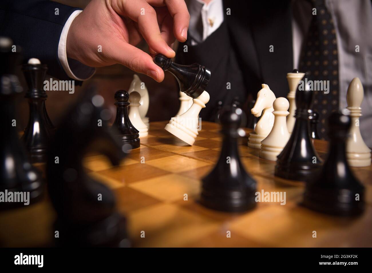 Rich businessmen playing chess Stock Photo - Alamy