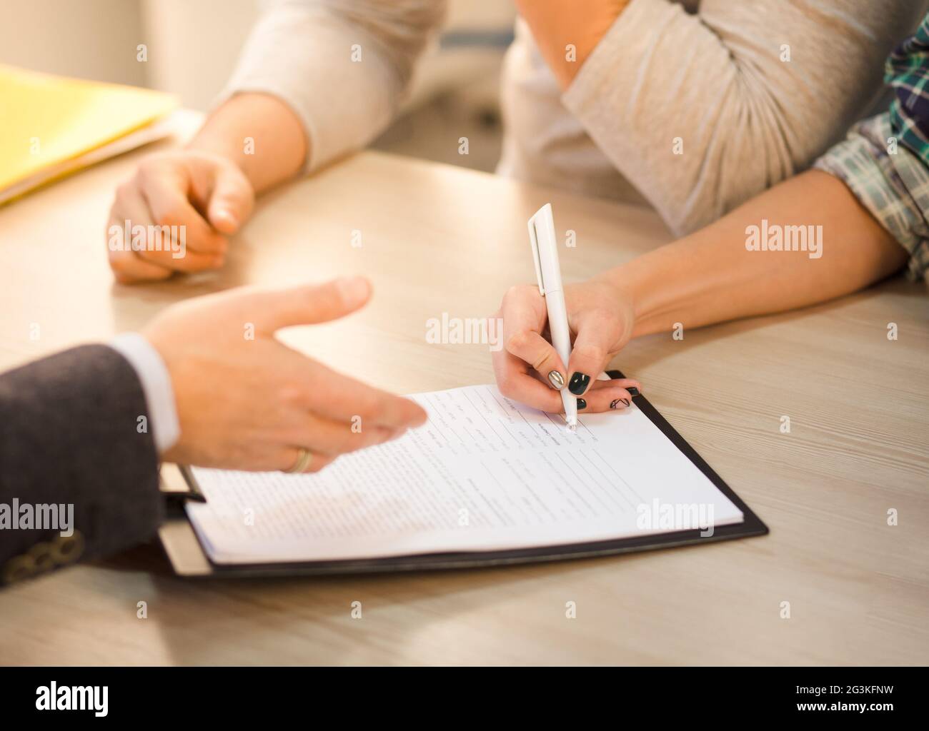 Salesman offering contract Stock Photo - Alamy