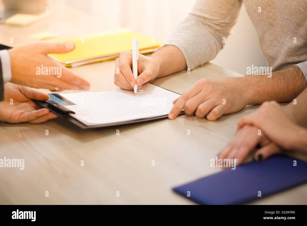 Salesman offering contract Stock Photo - Alamy