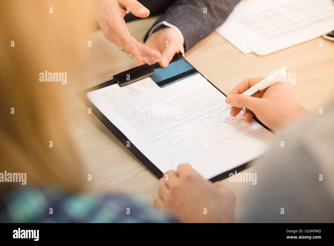Salesman offering contract Stock Photo - Alamy