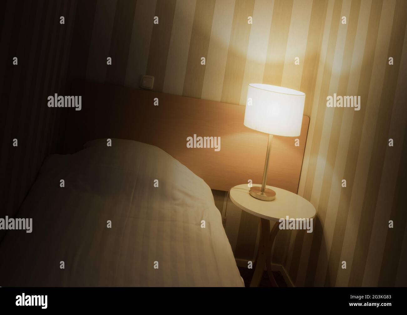 Simple hotel room, single bed Stock Photo - Alamy