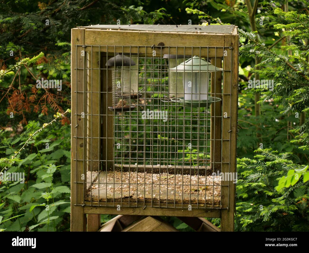Cage for birds in a garden Stock Photo - Alamy