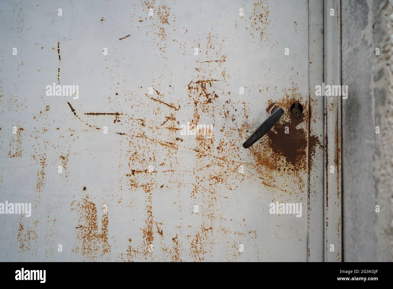 Old metal door with weathered white paint Stock Photo - Alamy