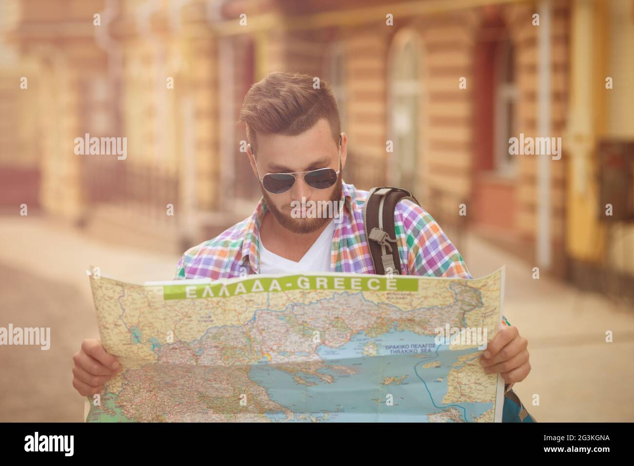 Young man looking map hi-res stock photography and images - Alamy
