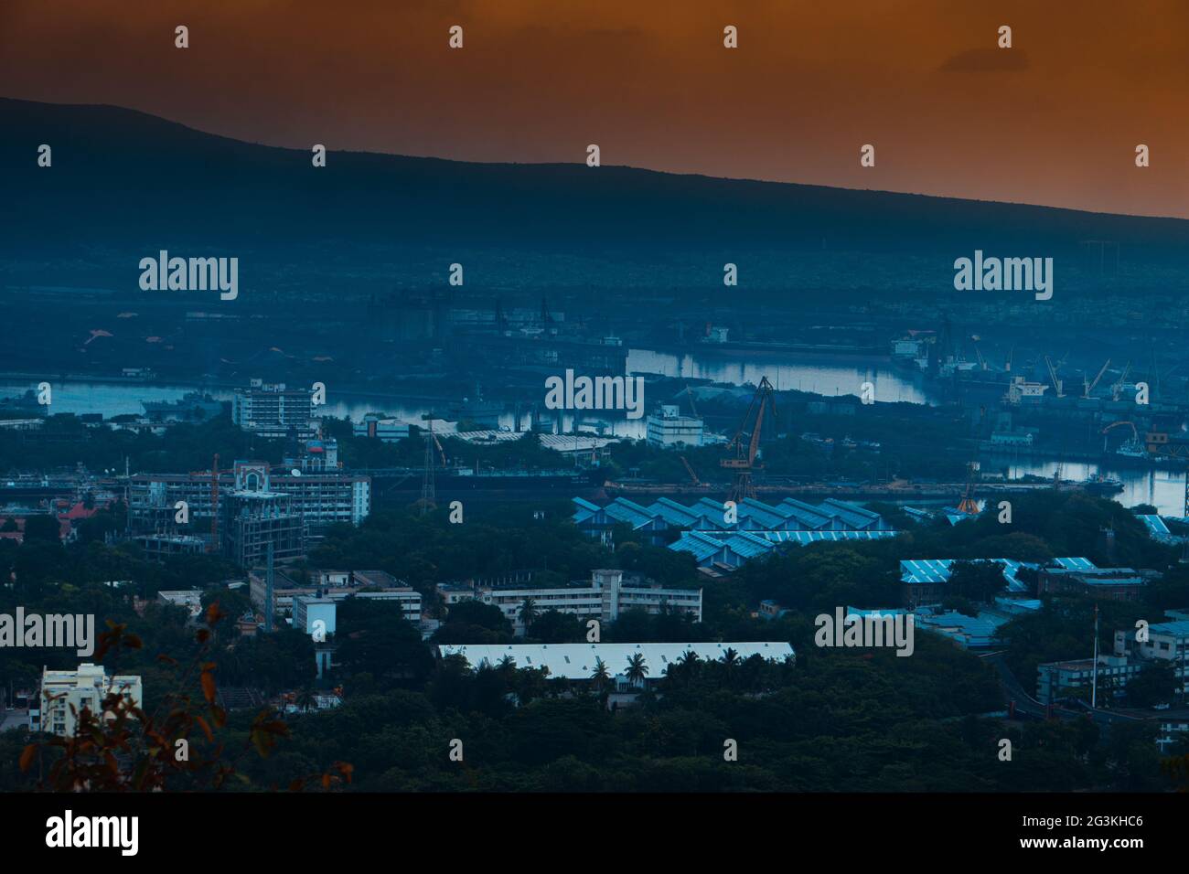 Beautiful shot of a town under a cloudy sky at sunset Stock Photo - Alamy