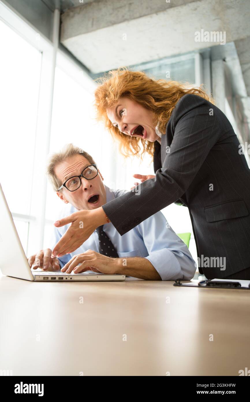 Angry boss screaming at workers Stock Photo - Alamy