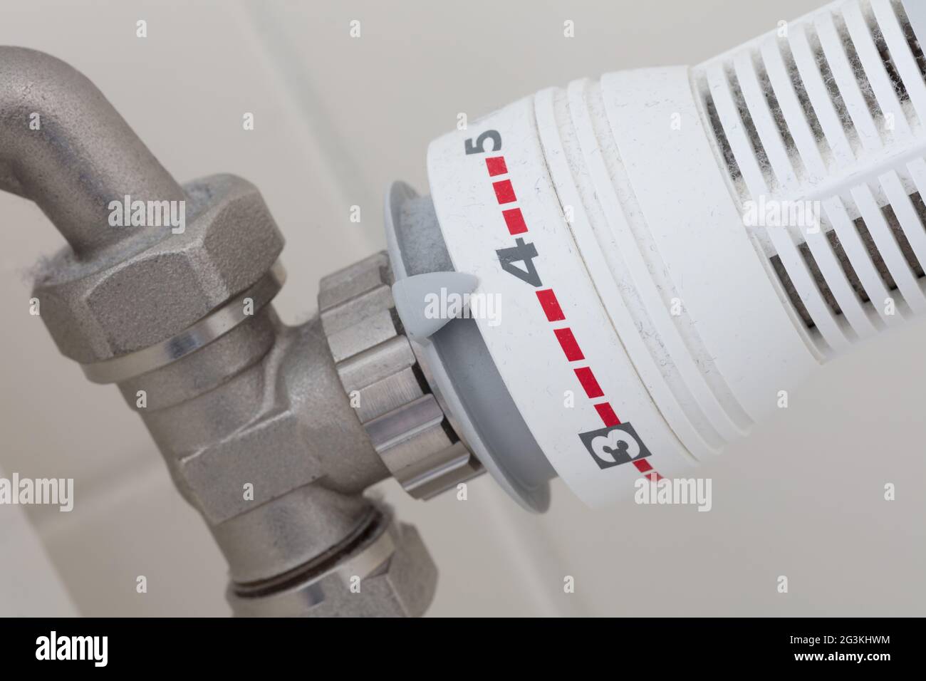 Temperature knob of heating radiator, used and dusty Stock Photo - Alamy