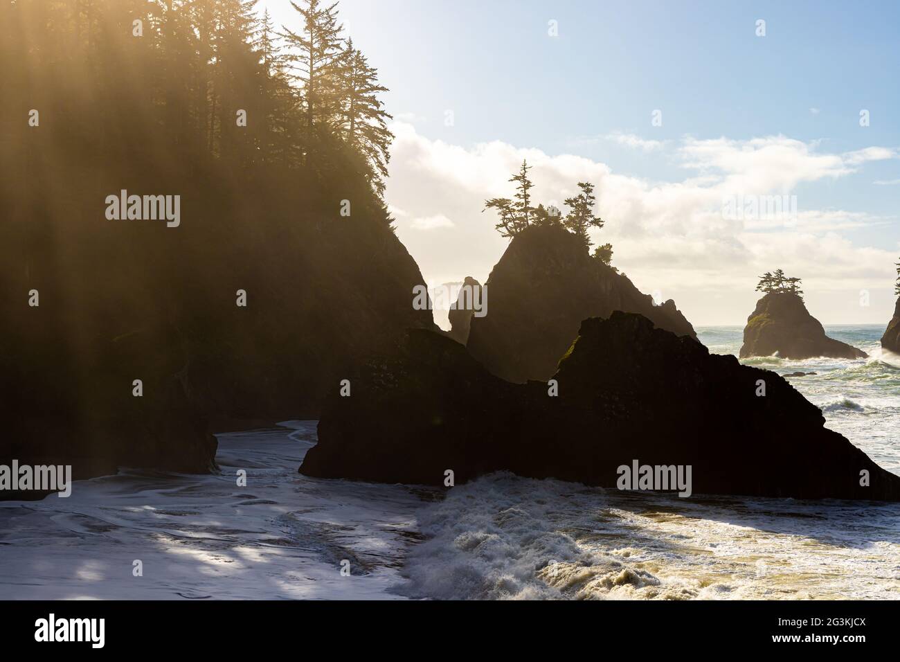 Waves surrounding a small island at Secret Beach in Samuel H. Boardman ...
