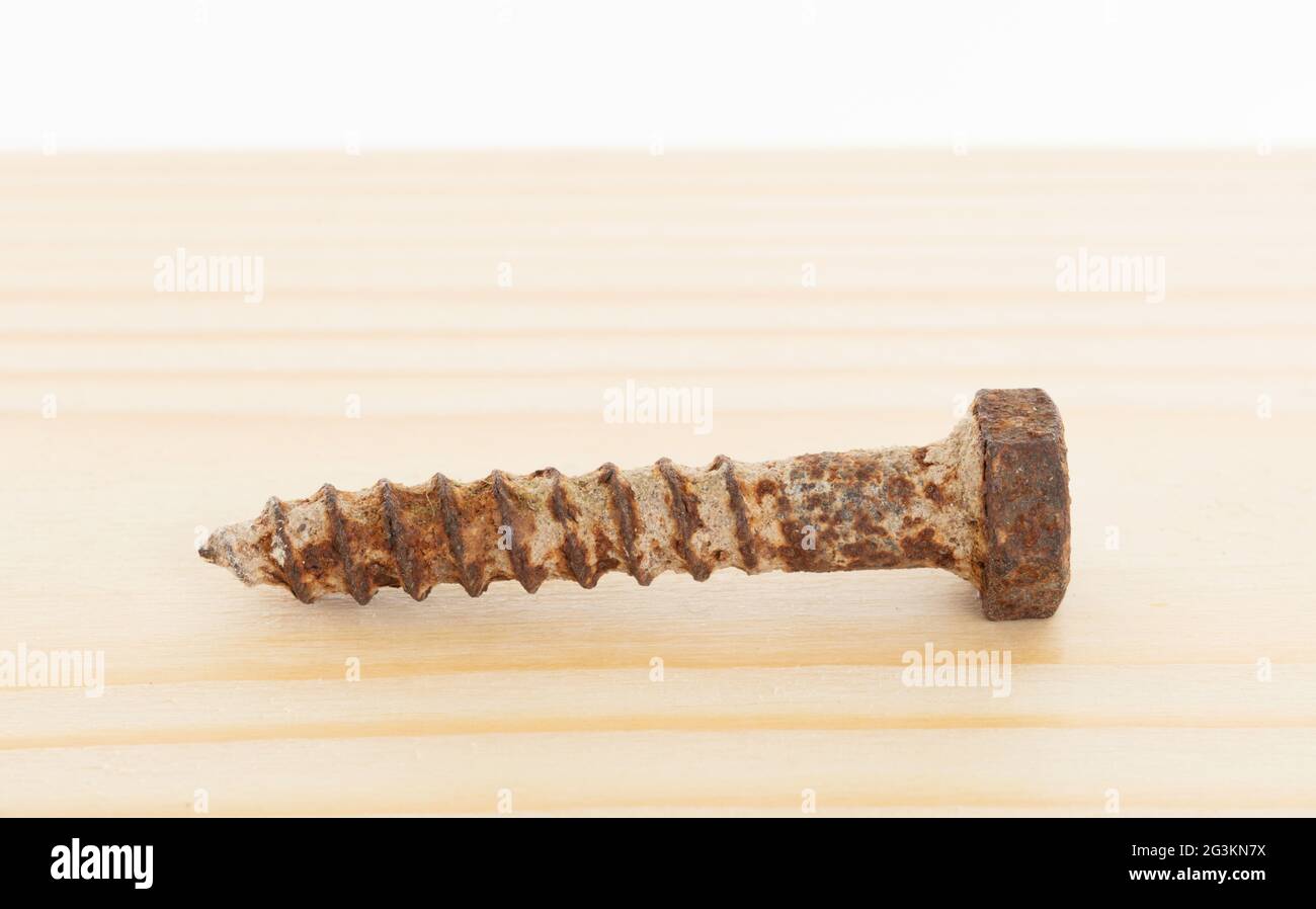 Rusted old screw isolated Stock Photo - Alamy