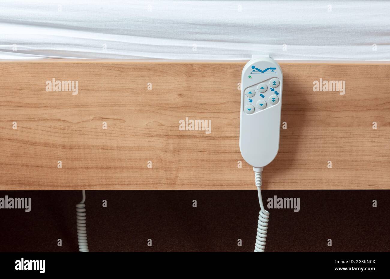 Bed remote hanging at the side from a bed Stock Photo - Alamy