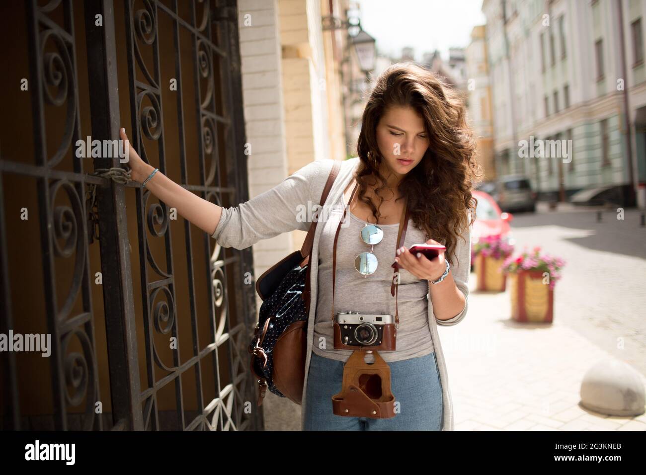 Woman walking while looking at cellphone hi-res stock photography and ...