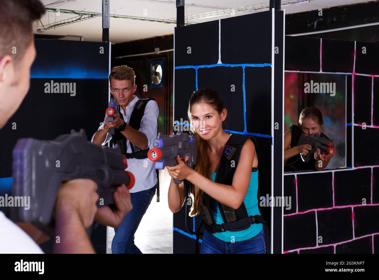 Young people playing laser tag Stock Photo - Alamy
