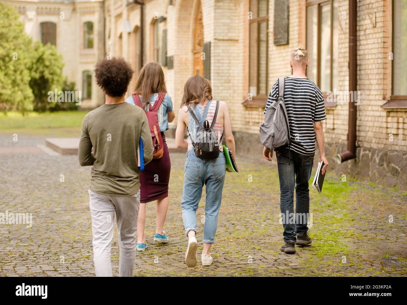 Rear view of young students going to college Stock Photo - Alamy