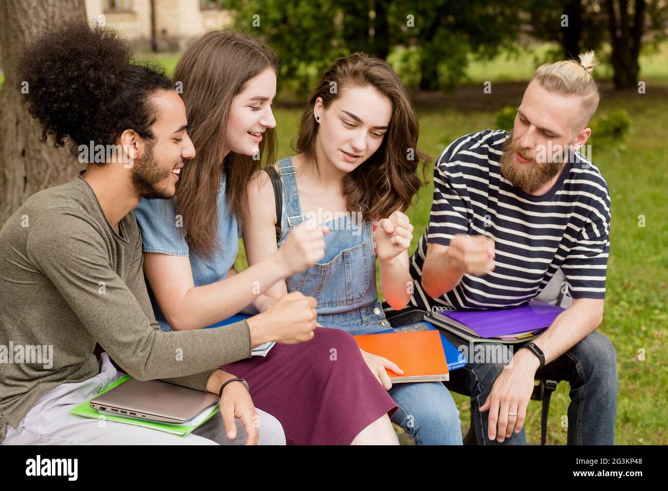 University students sitting on bench hi-res stock photography and ...