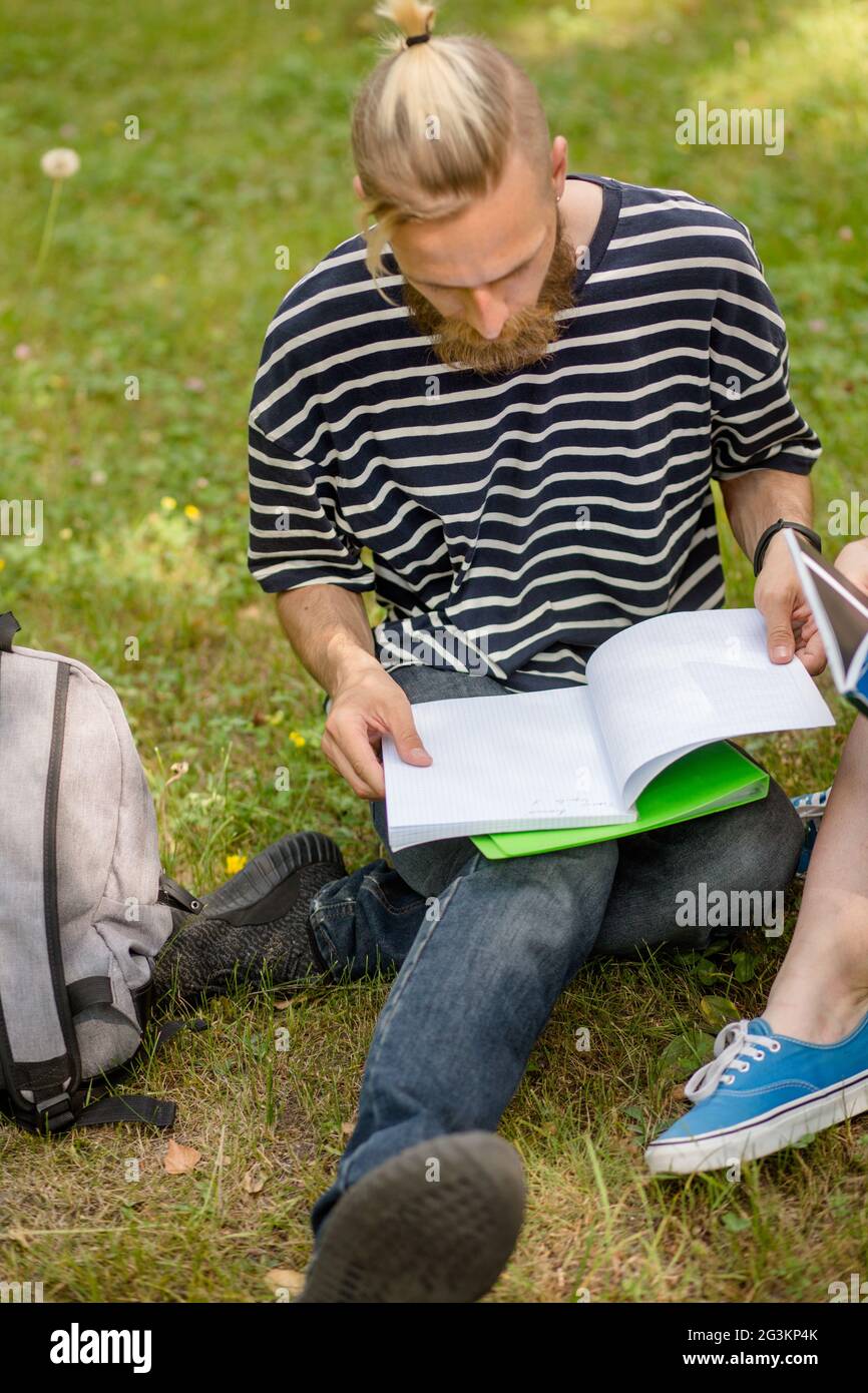 College Student Sitting On Grass High Resolution Stock Photography and ...