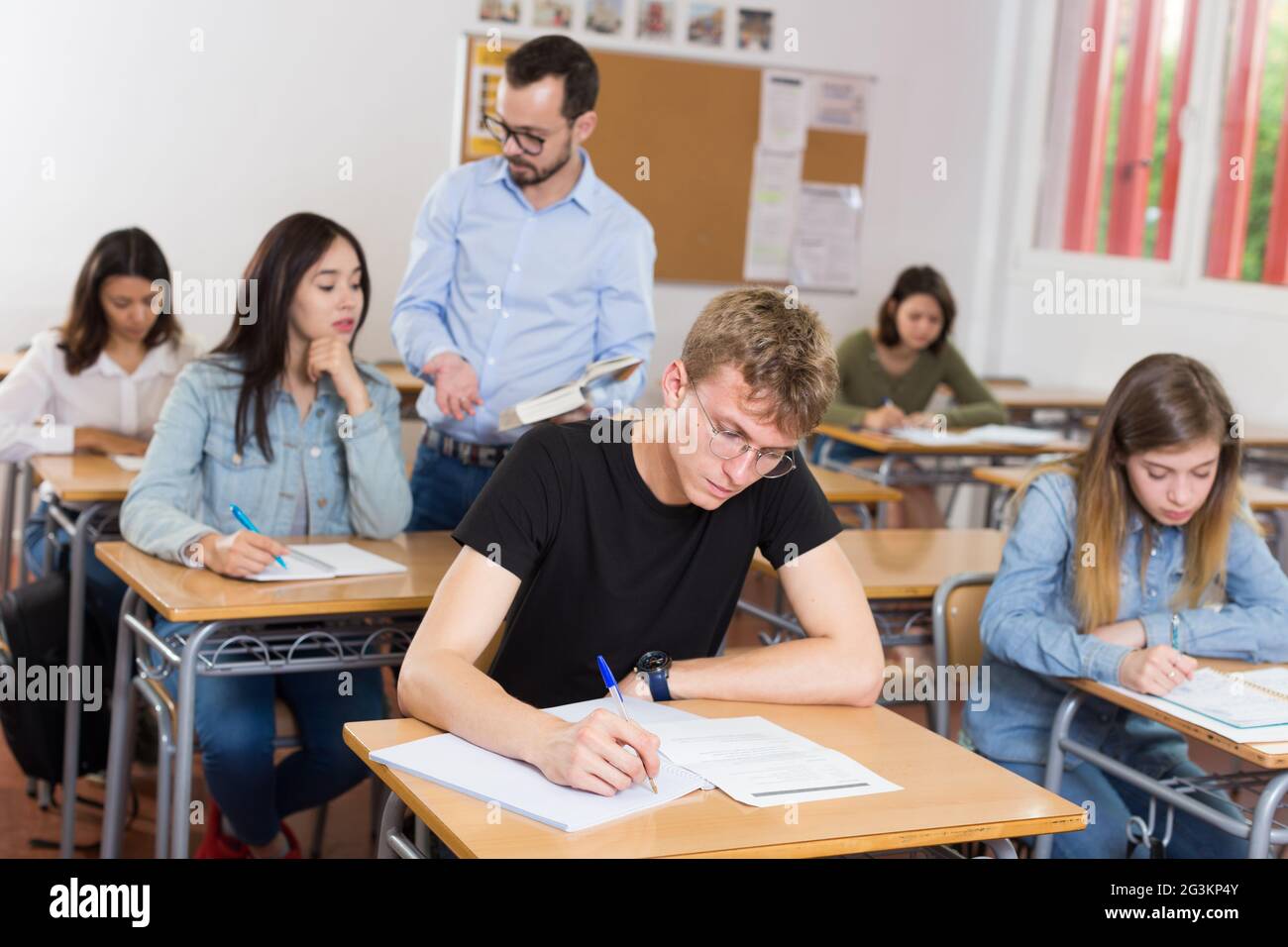 Student is sitting test and answer about task Stock Photo - Alamy