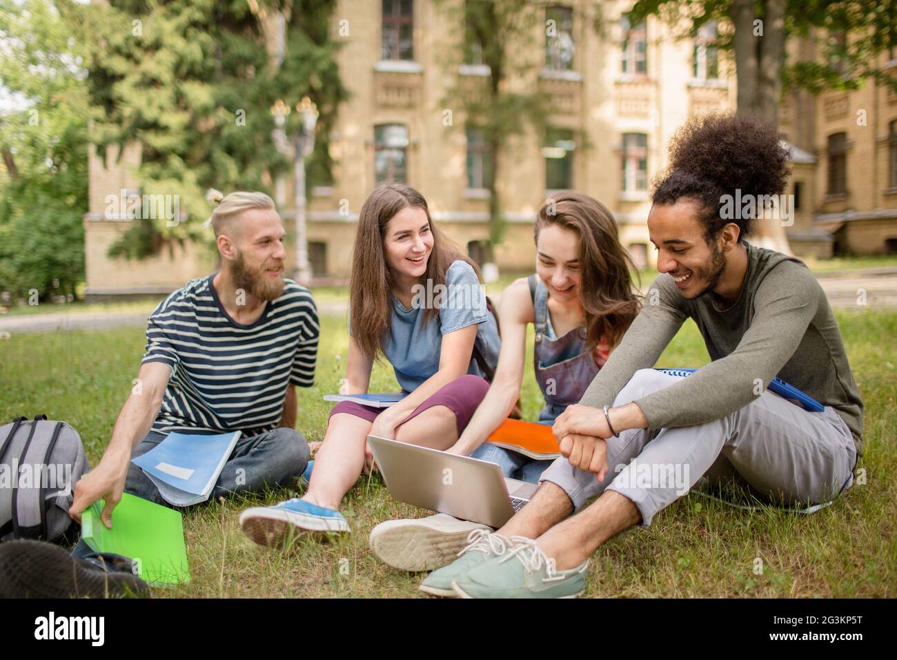 University students studying on grass Stock Photo - Alamy