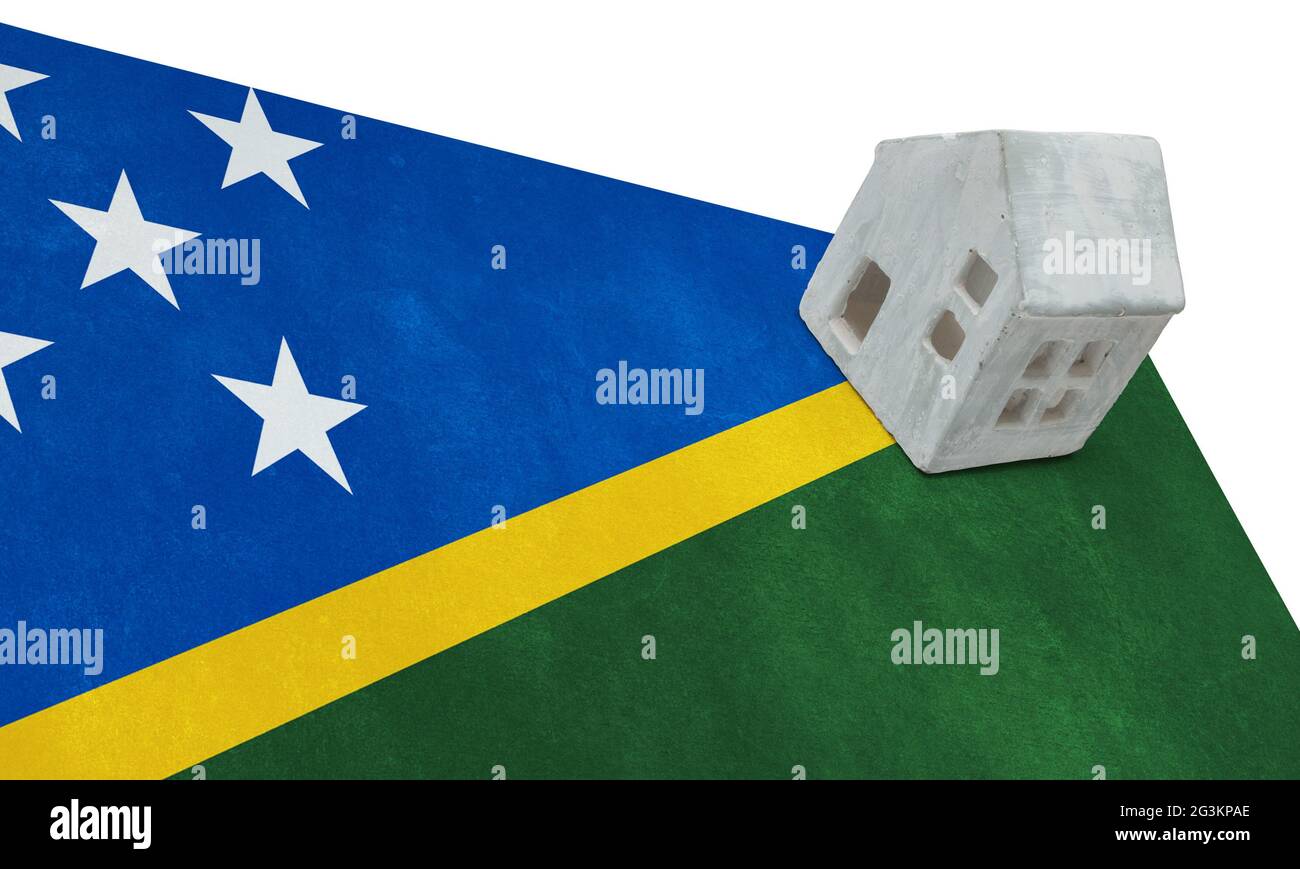 Small house on a flag - Solomon Islands Stock Photo - Alamy
