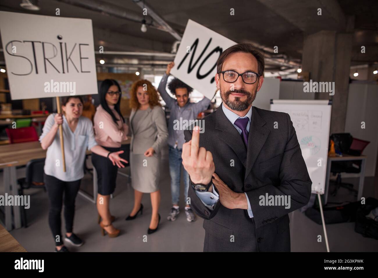 Director showing long finger, employees holding posters with words ...