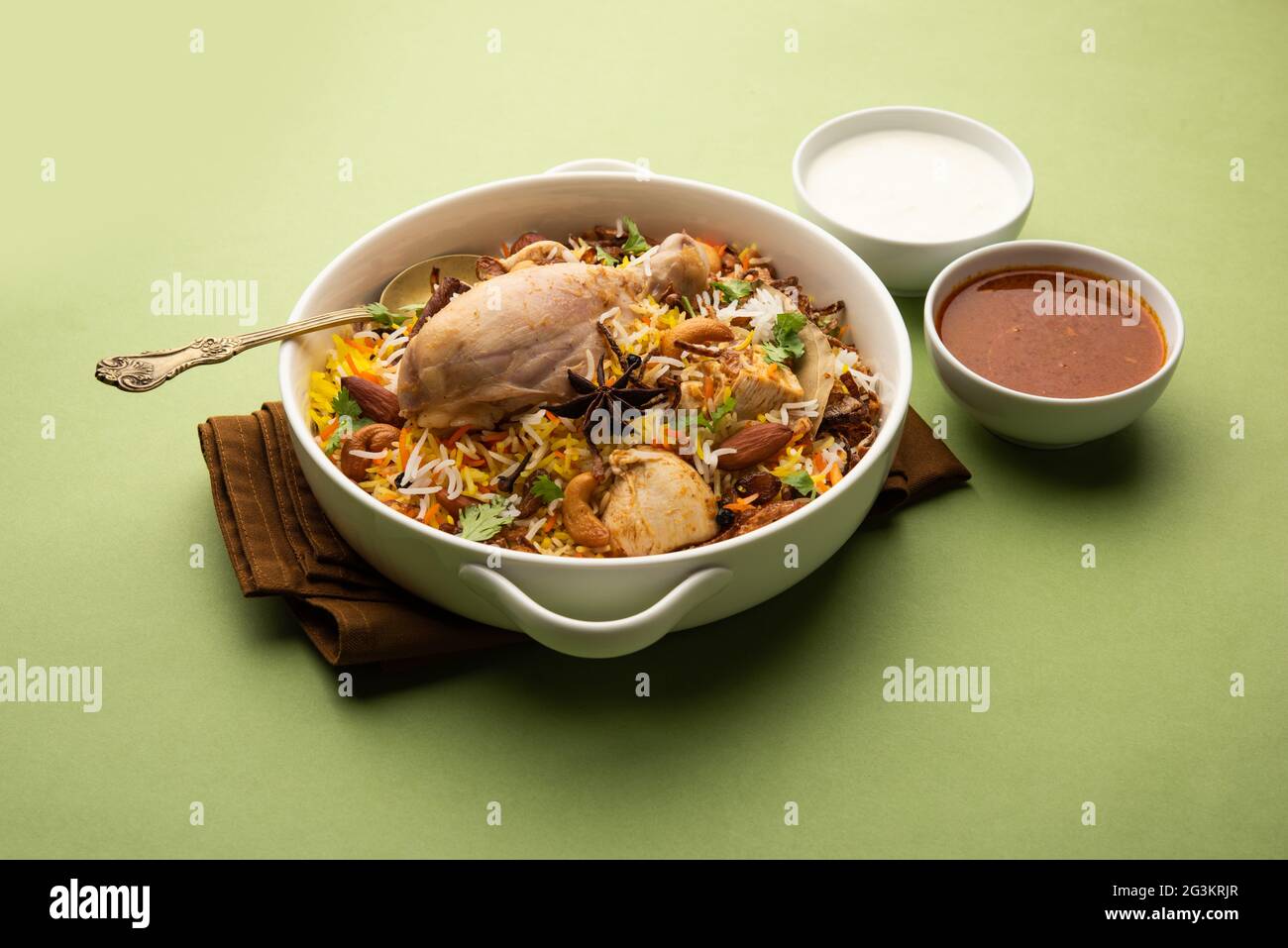 Restaurant style Spicy Chicken Biryani served with Raita and Salan ...