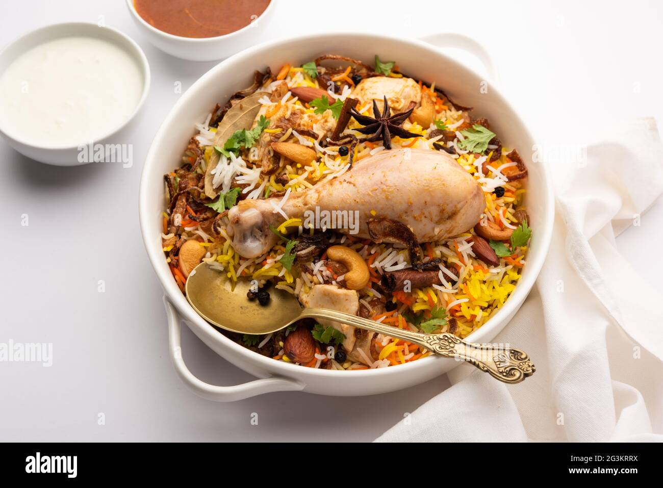 Restaurant style Spicy Chicken Biryani served with Raita and Salan ...
