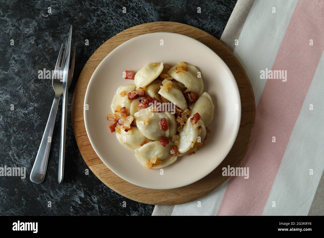 Concept of tasty food with vareniki or pierogi on dark table Stock ...