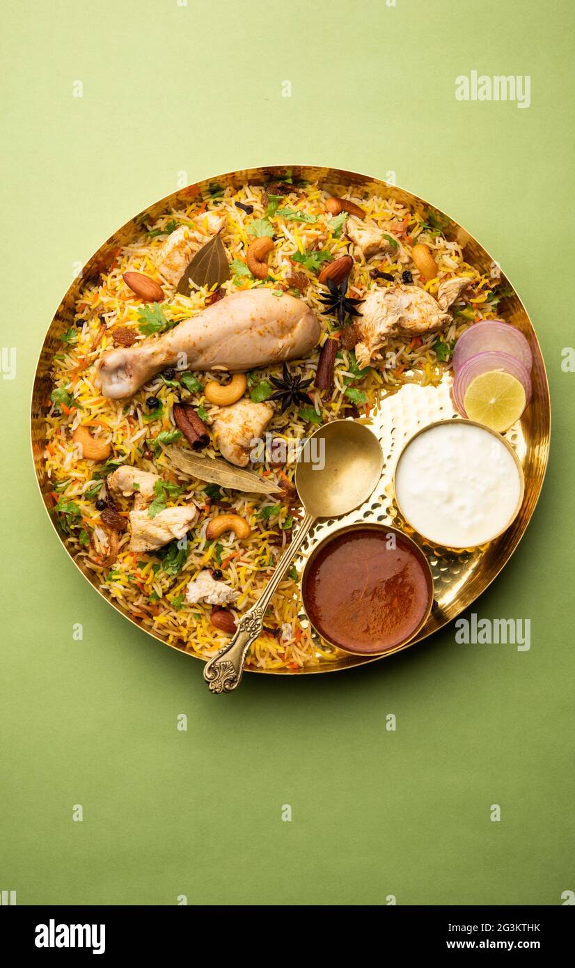 Restaurant style Spicy Chicken Biryani served with Raita and Salan ...