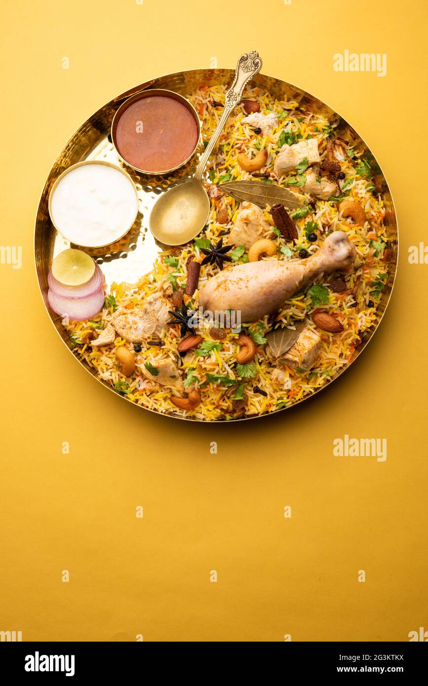 Restaurant style Spicy Chicken Biryani served with Raita and Salan ...