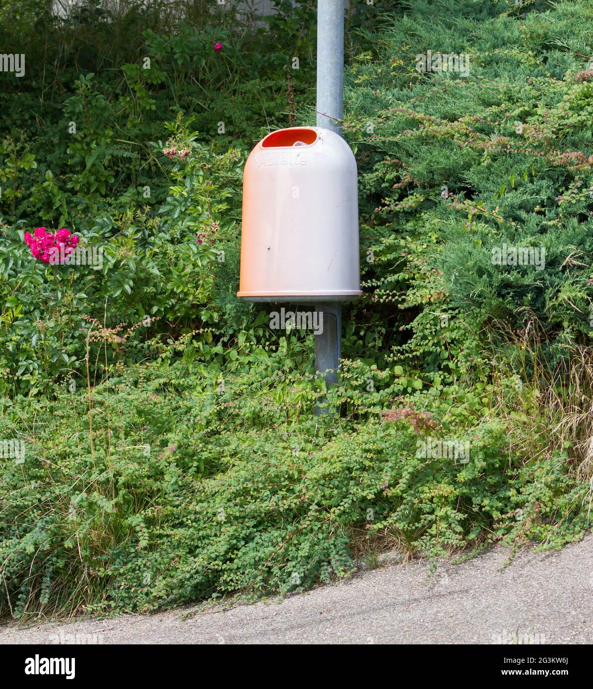 Old bin, hanging on a pole Stock Photo - Alamy