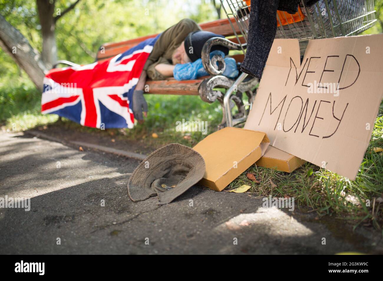 Homeless old man sleeping on bench, begging for money Stock Photo - Alamy