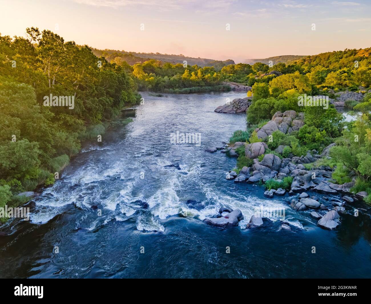 Amazing surfs on the river. Deep river canyon early in the morning ...