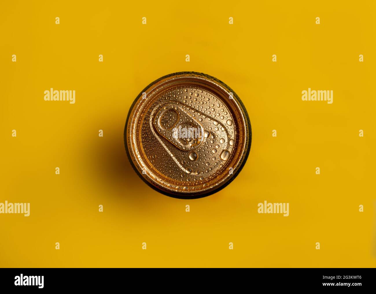 top view of a metal jar top view on a yellow background Stock Photo - Alamy