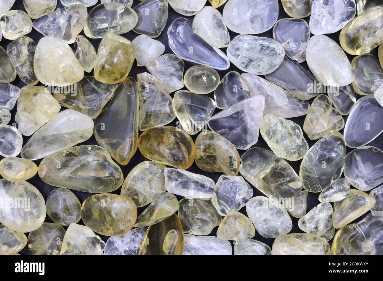Citrine heap jewel stones texture on black background Stock Photo - Alamy