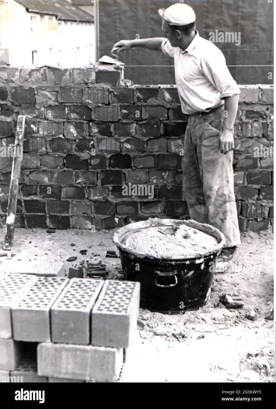 people, mason, working on brick wall, 1950s, ADDITIONAL-RIGHTS ...