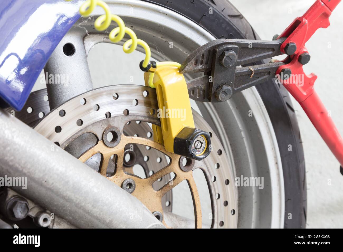 Security lock blocking the motorcycle wheel Stock Photo - Alamy