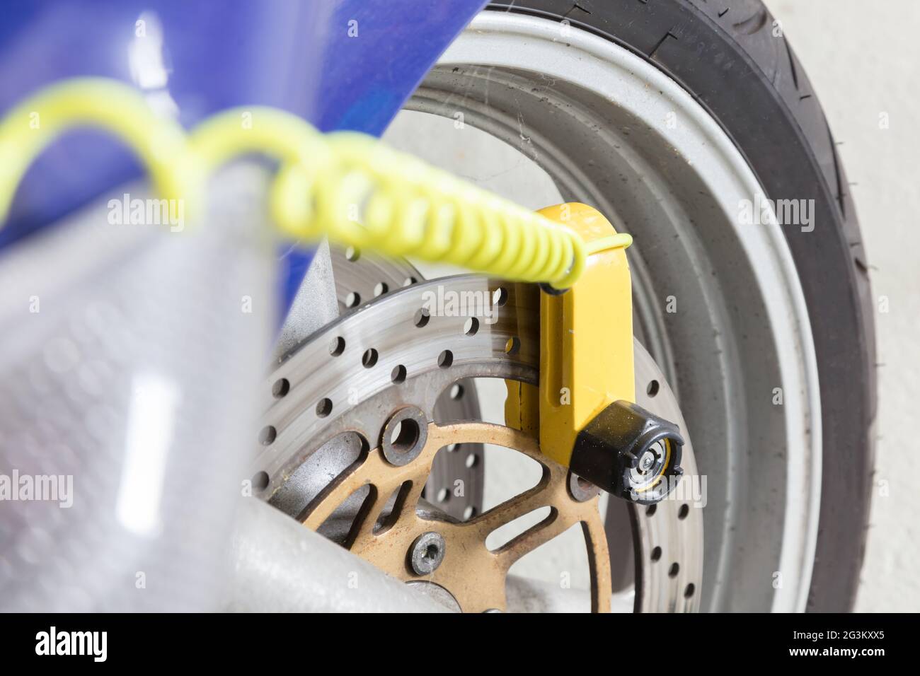Security lock blocking the motorcycle wheel Stock Photo - Alamy